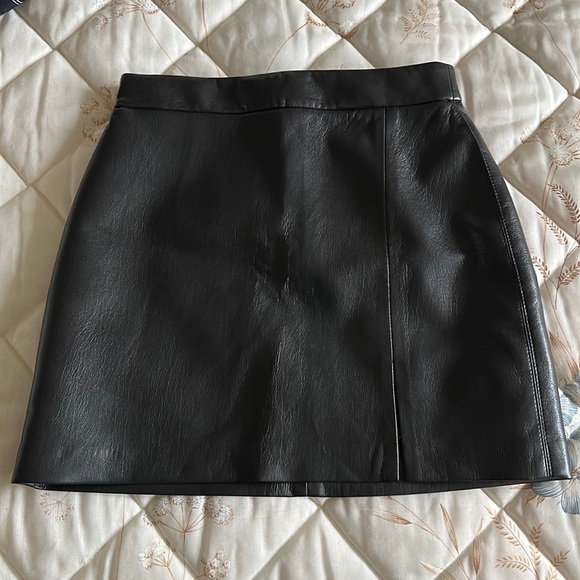 Aritzia | Skirts | Black Faux Leather Aritzia Skirt With Small Leg Slit In Left Hand Side | Poshmark